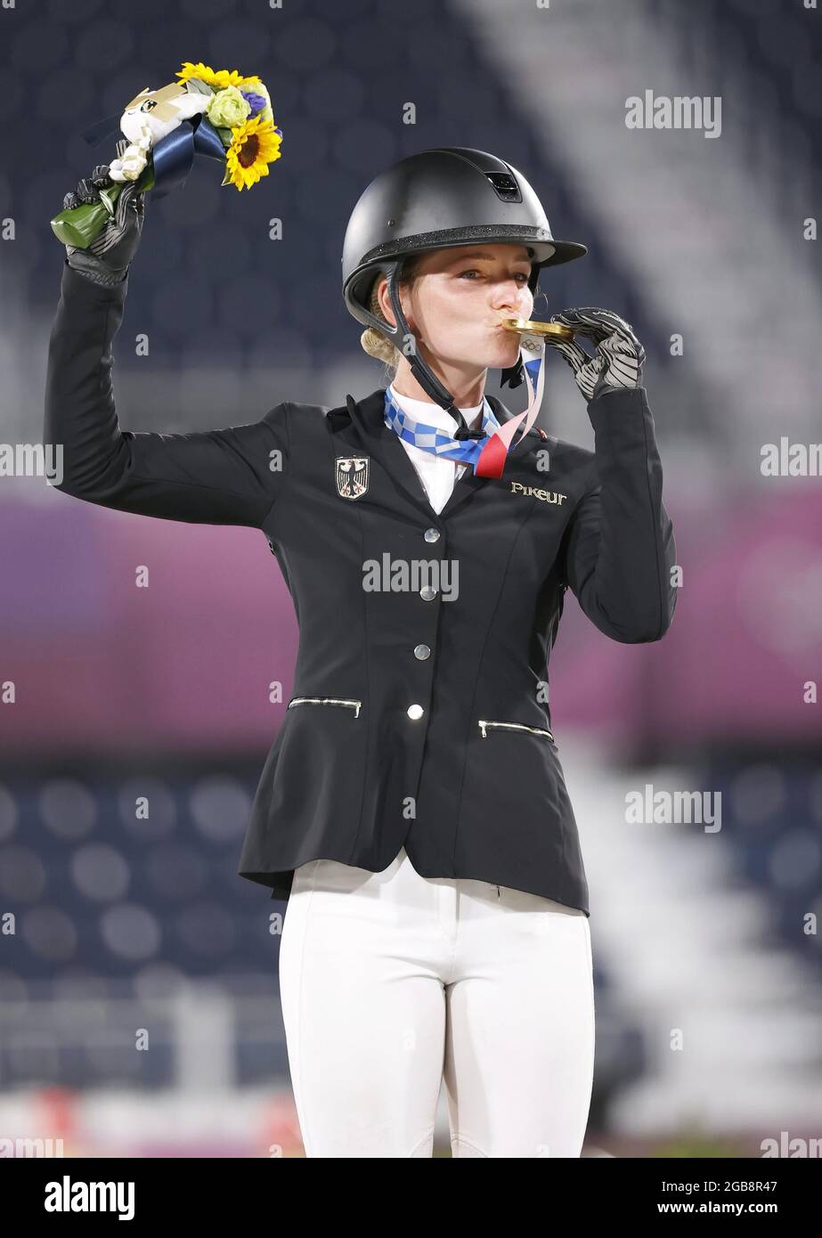 Julia Krajewski of Germany kisses her gold medal after winning the ...