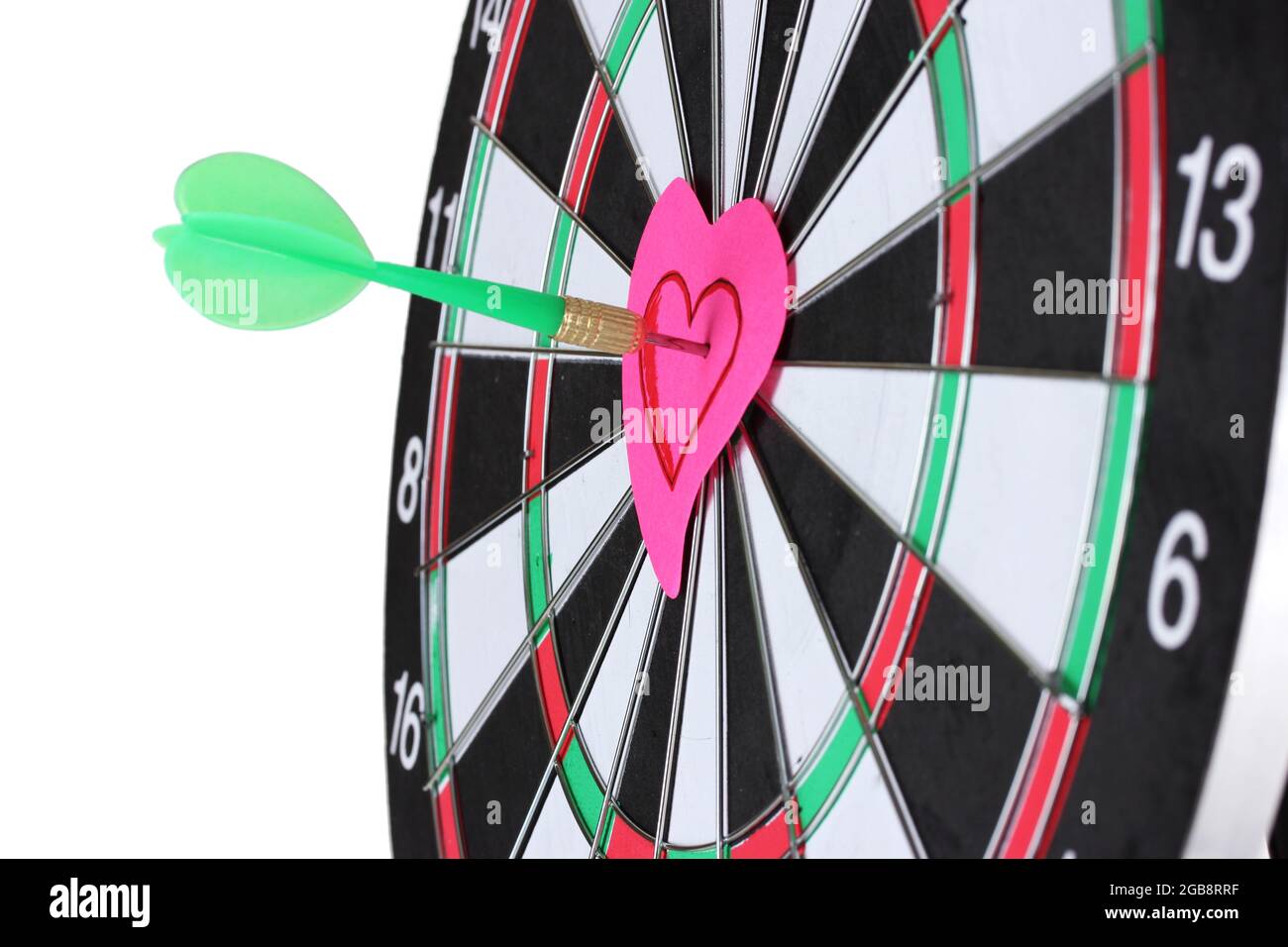 Darts with stickers depicting the life values close-up on white ...