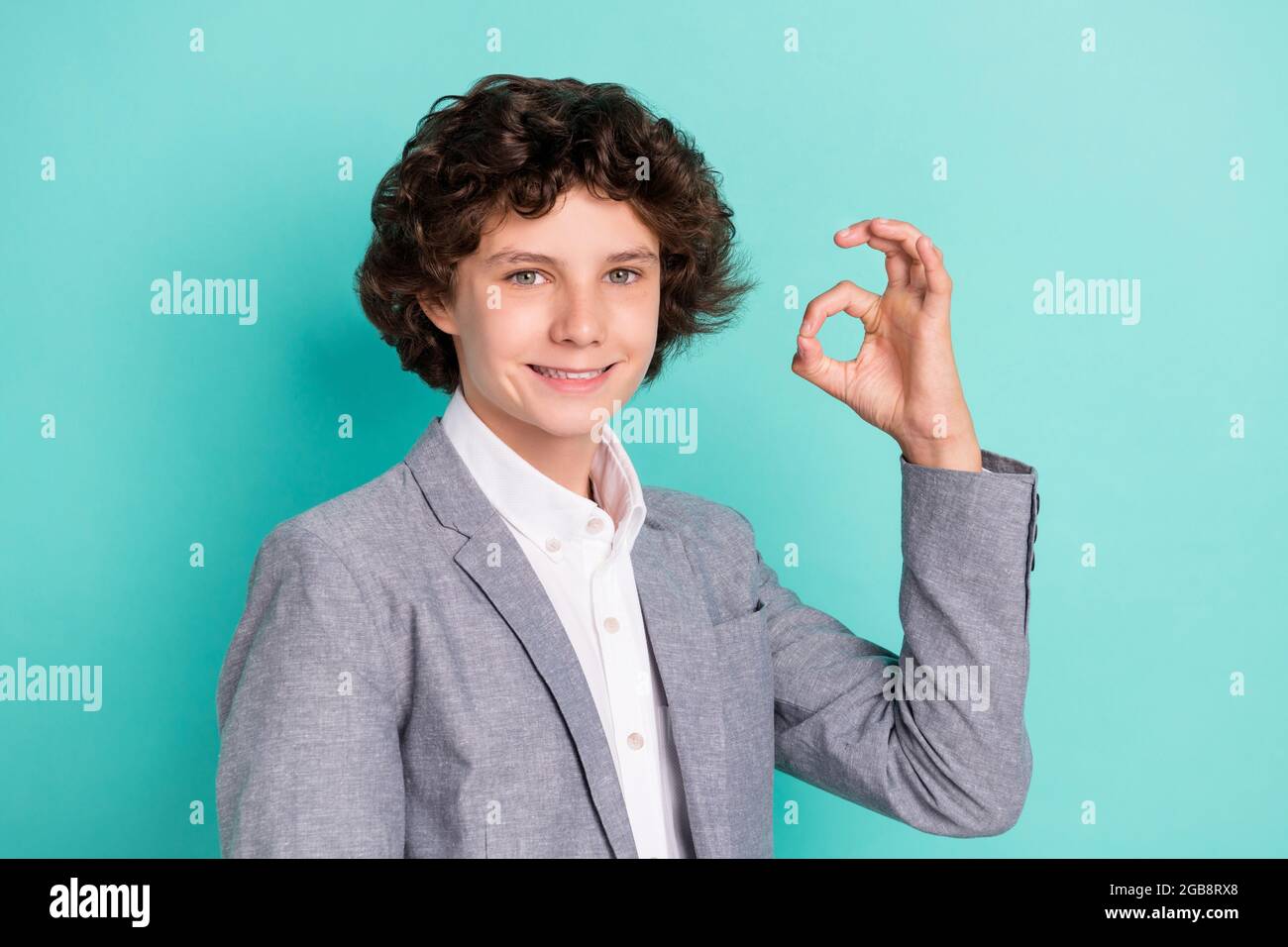 Photo of attractive sweet schoolboy dressed grey suit smiling showing ...