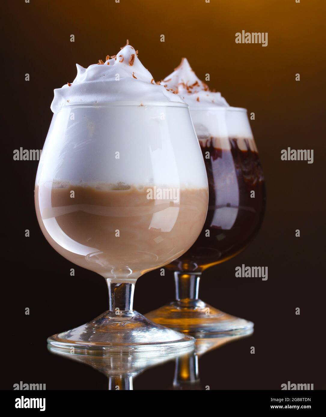 glasses of coffee cocktail on brown background Stock Photo - Alamy