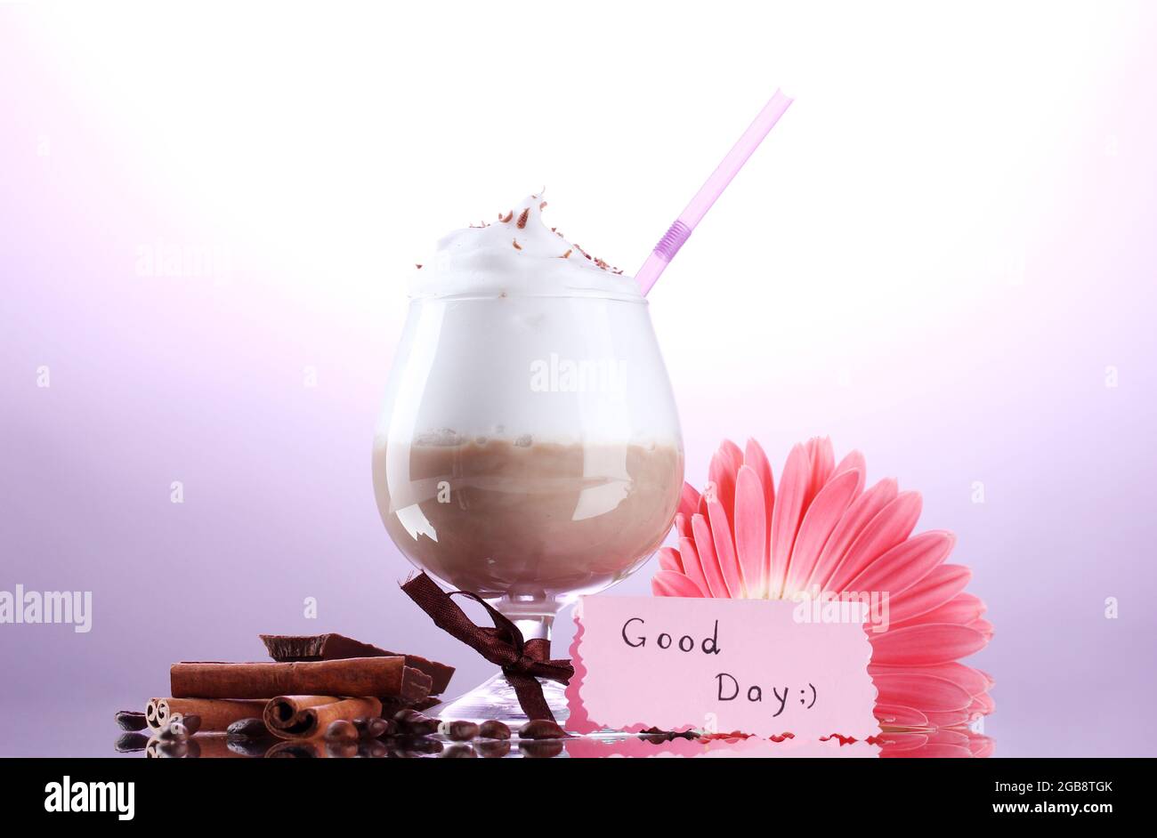 glass of coffee cocktail and gerbera flower on purple background Stock ...