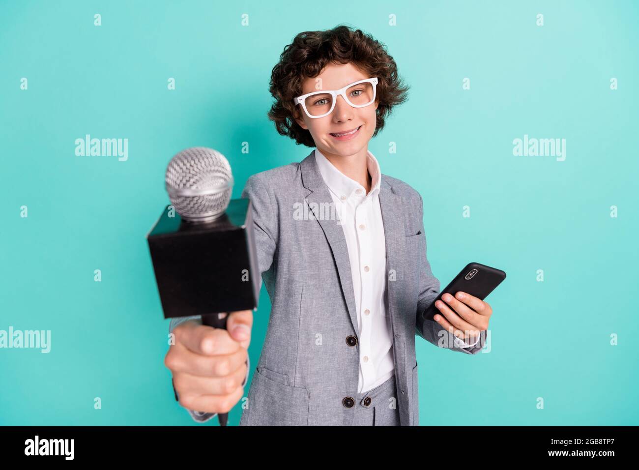 Photo of pretty charming school boy wear grey jacket spectacles tacking ...