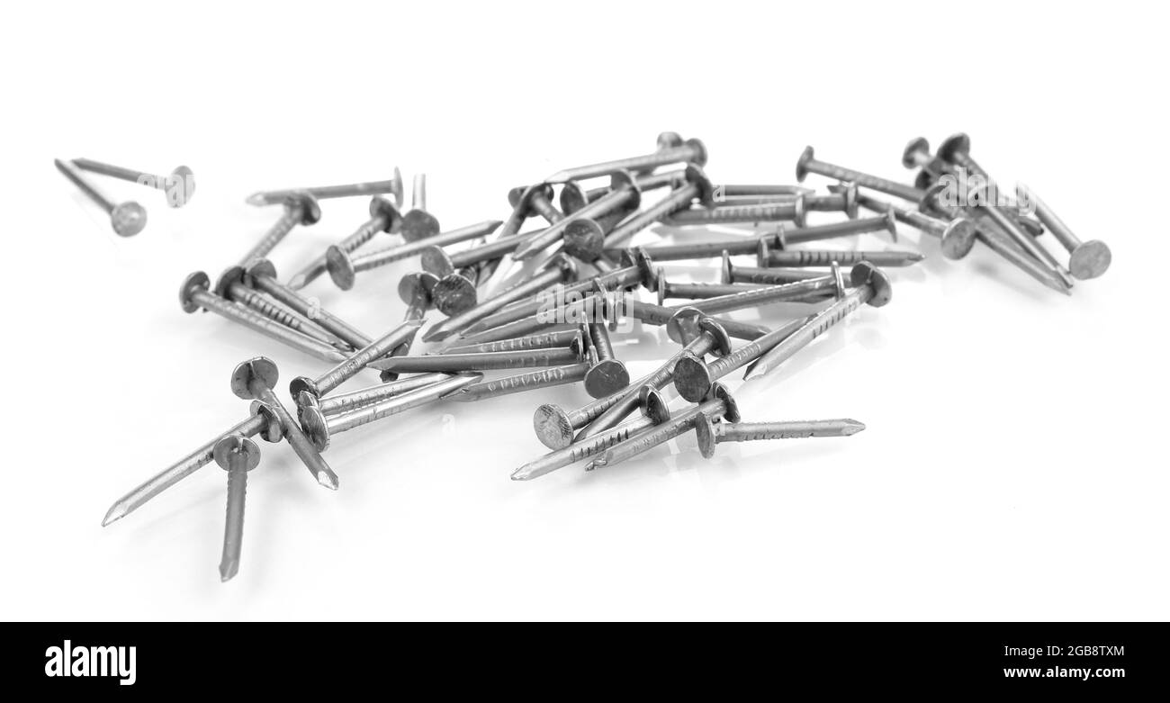 Metal nails isolated on white Stock Photo - Alamy