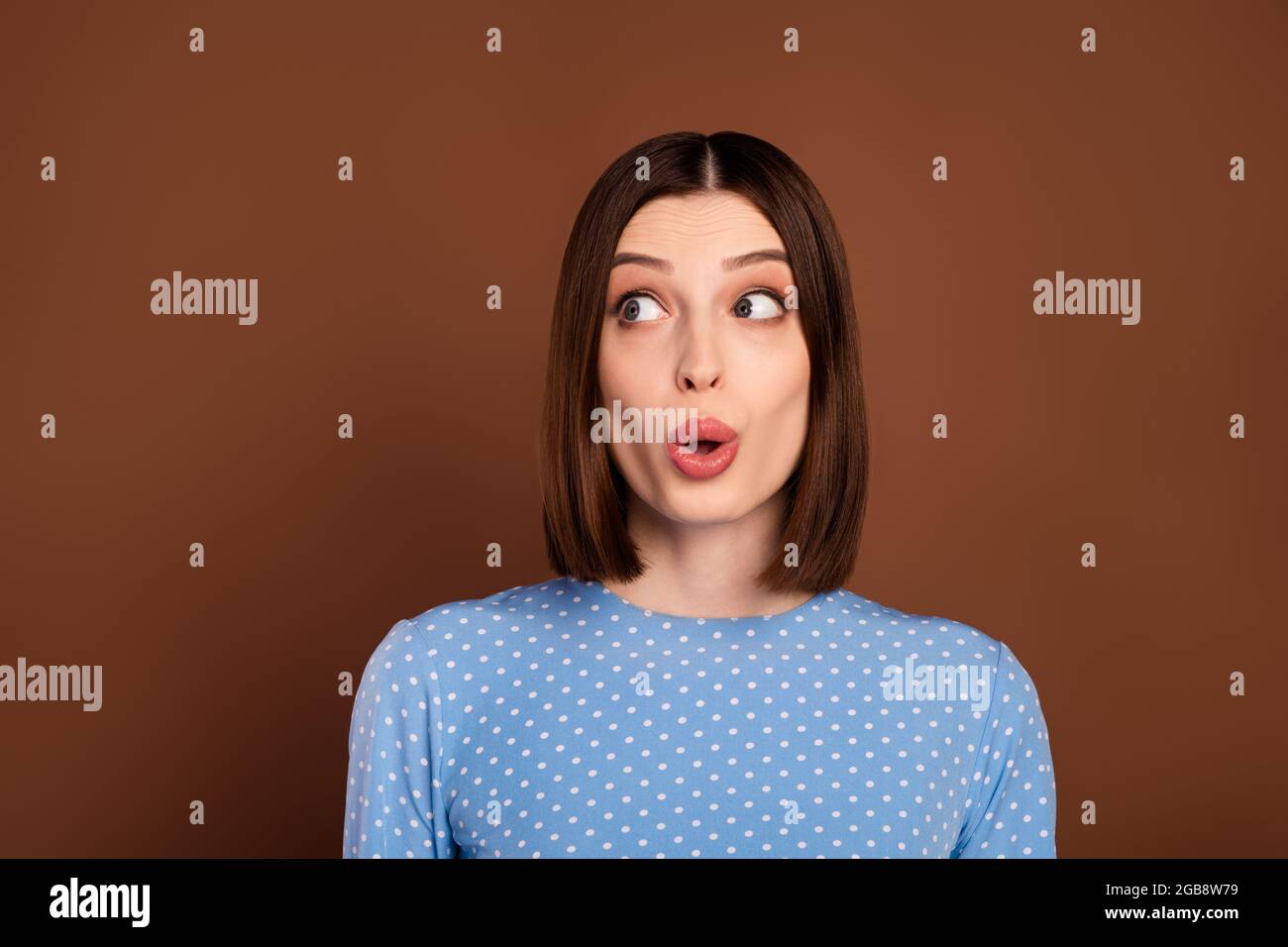 Photo of staring brunette millennial lady look empty space wear dotted ...