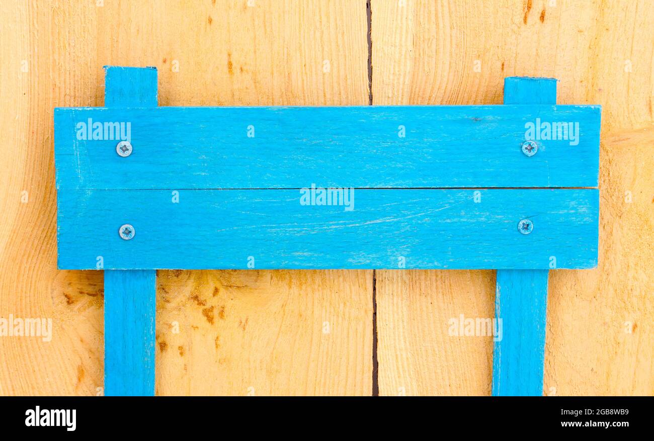 Color wooden sign board on wooden background Stock Photo - Alamy