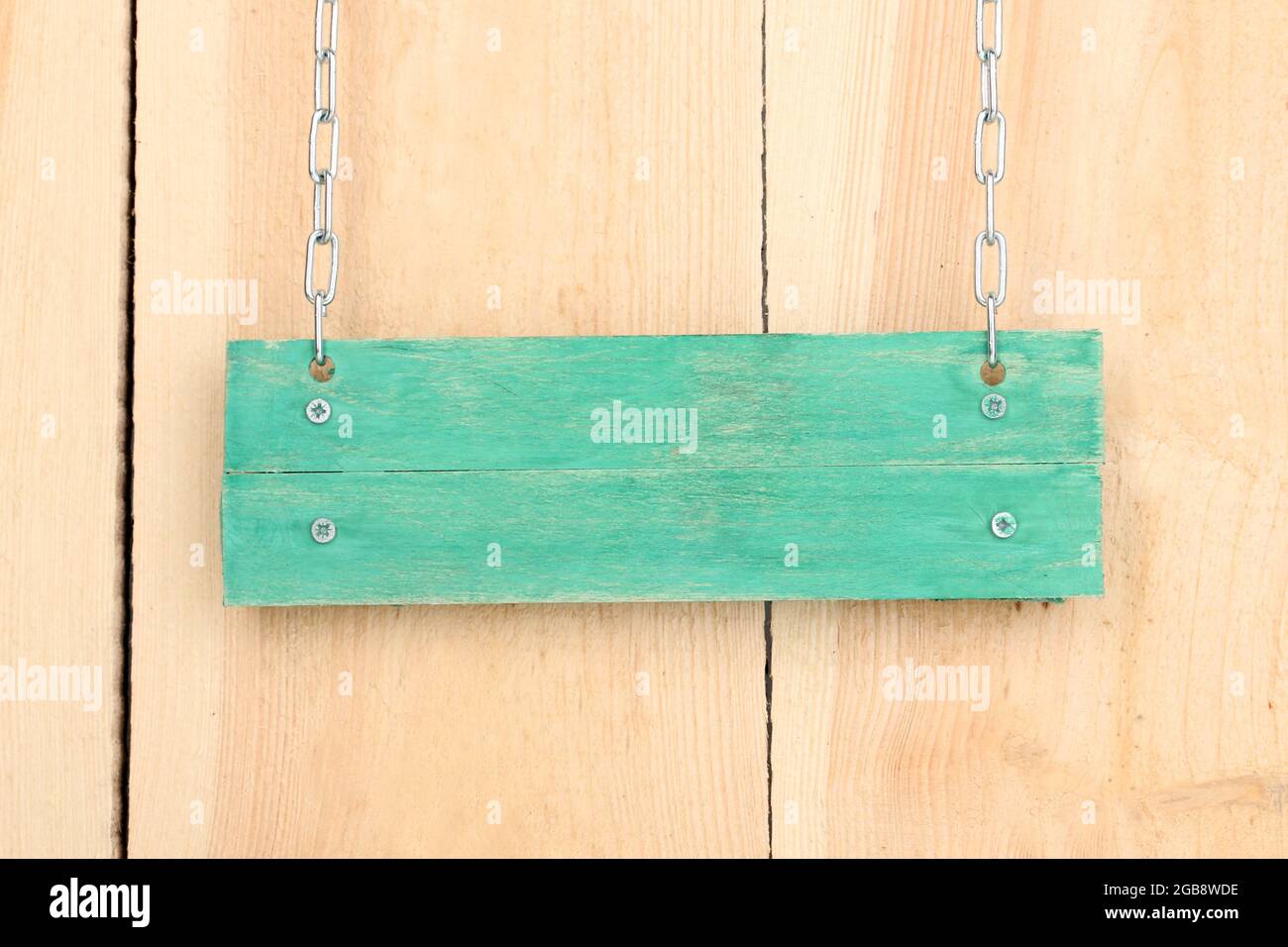 Color wooden sign board on wooden background Stock Photo - Alamy