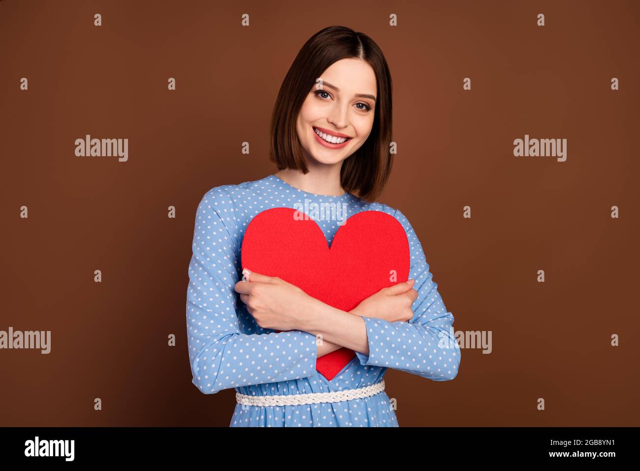 Photo of flirty bob hairdo young lady hug heart wear blue blouse ...