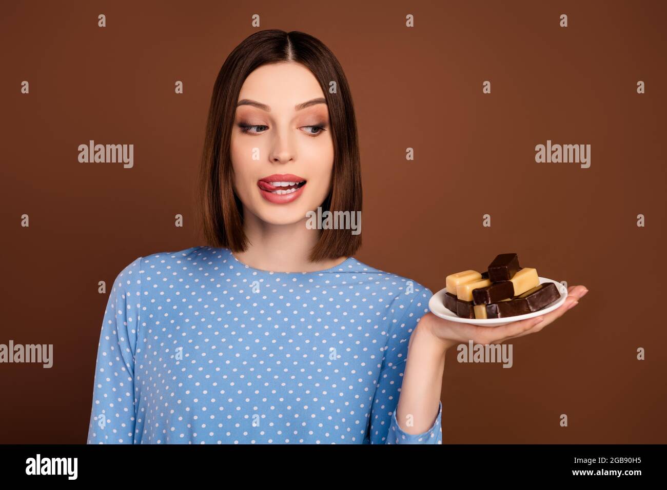 Photo of joyful short hairdo millennial lady look sweets wear blue ...