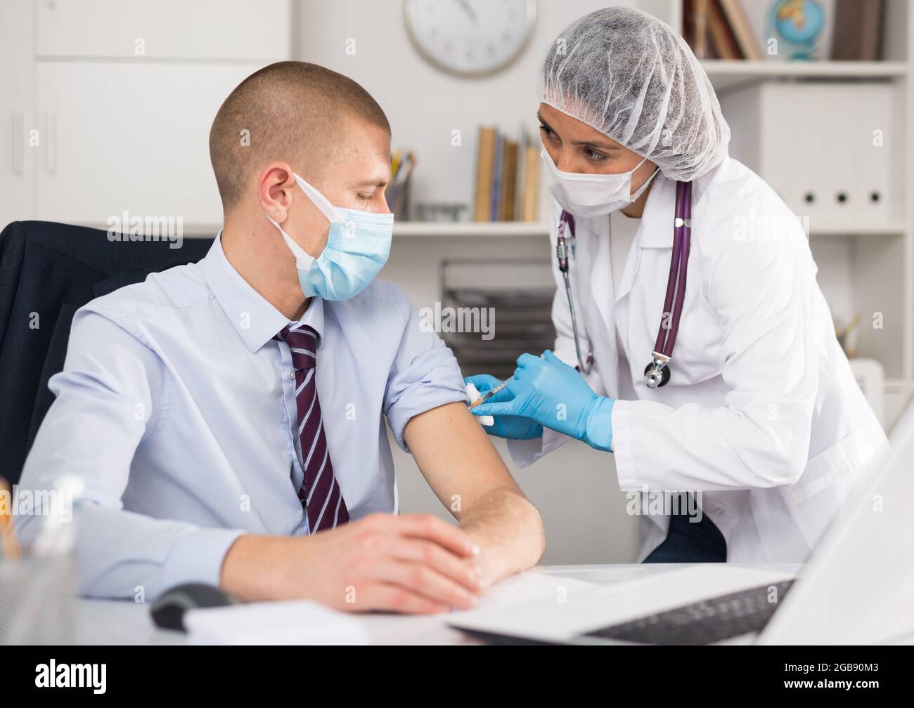 Doctor giving Covid-19 or flu antivirus vaccine shot to patient Stock ...