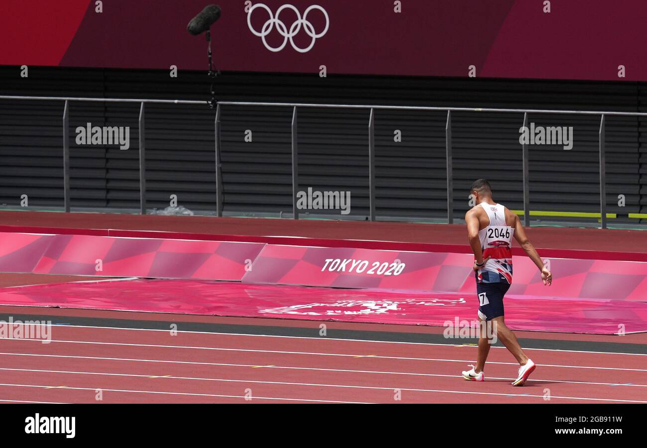 Great Britain's Adam Gemili walks the track after pulling up injured ...