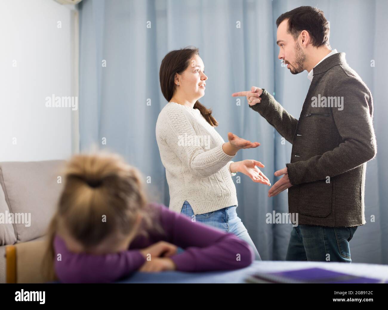 Brunette mother and father arguing with each other Stock Photo - Alamy