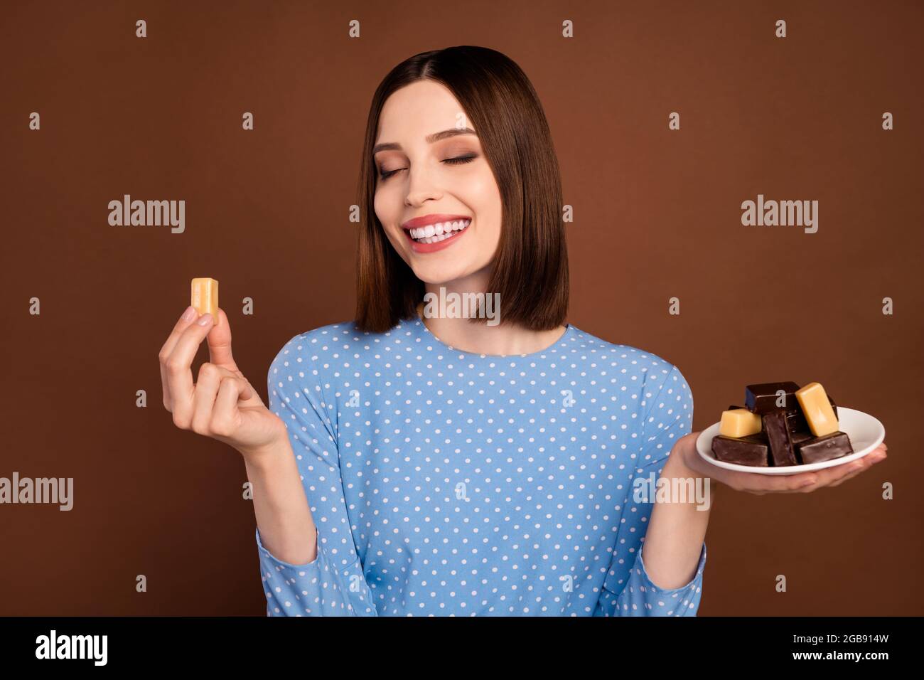 Photo of young attractive girl happy positive smile eat dessert tasty ...