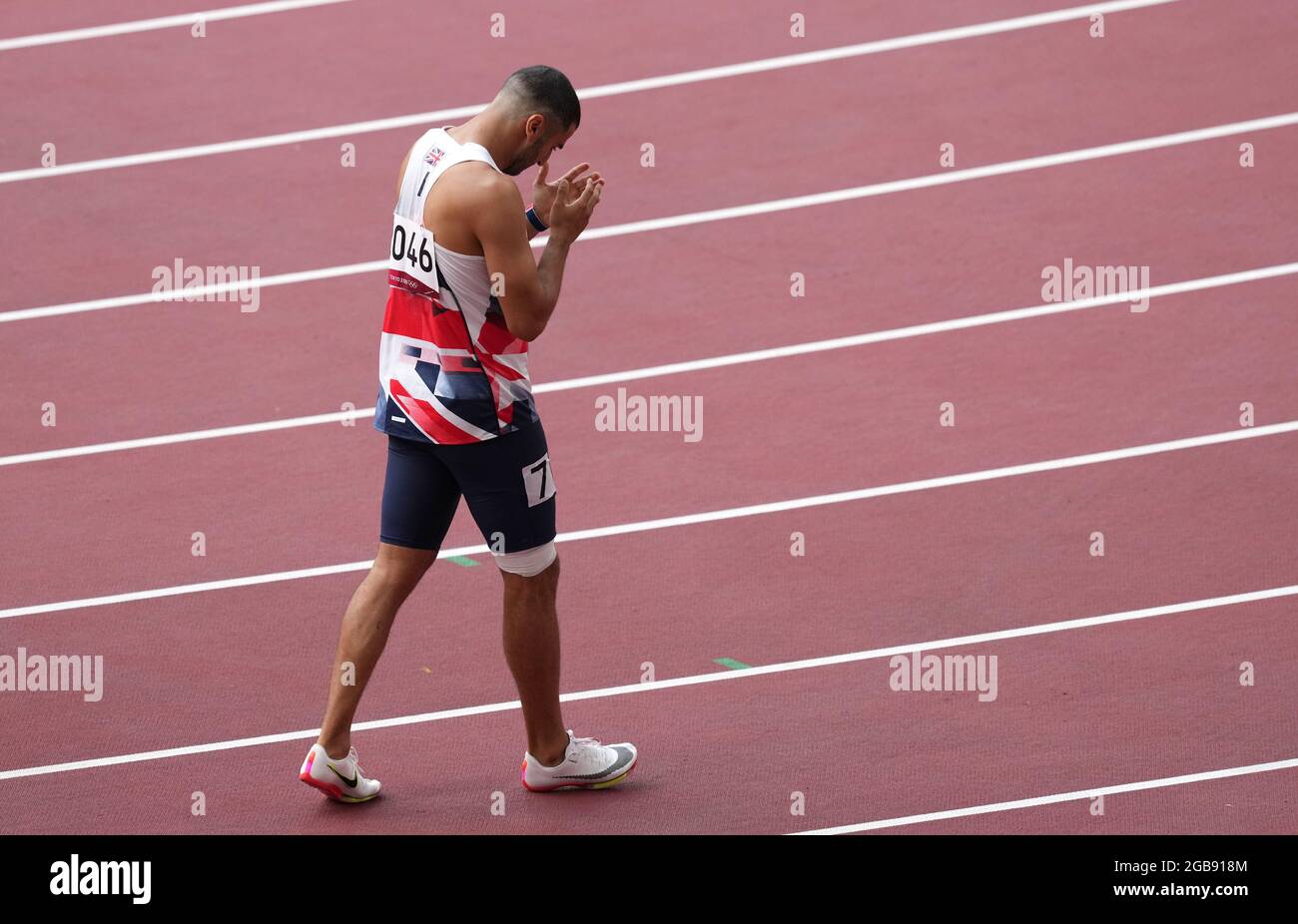 Great Britain's Adam Gemili walks the track after pulling up injured ...