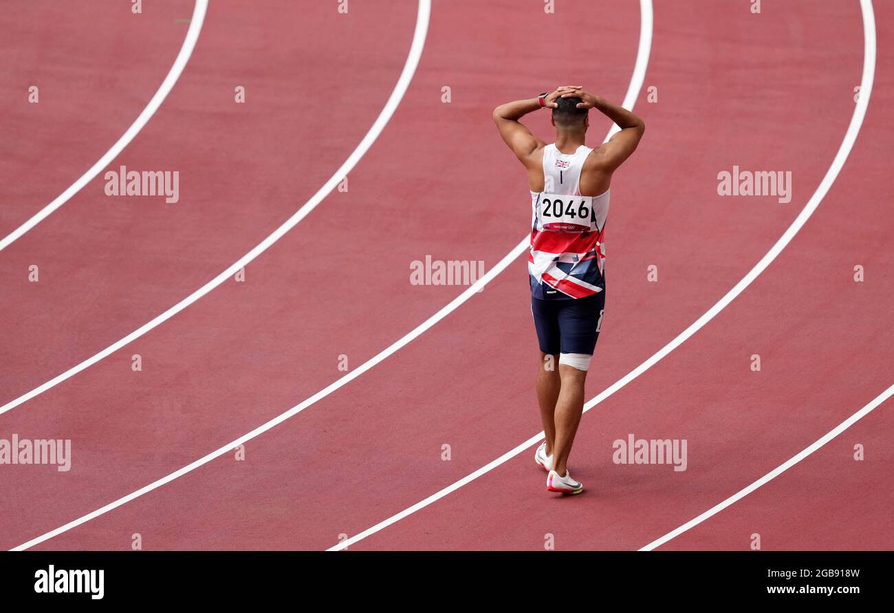 Great Britain's Adam Gemili walks the track after pulling up injured ...