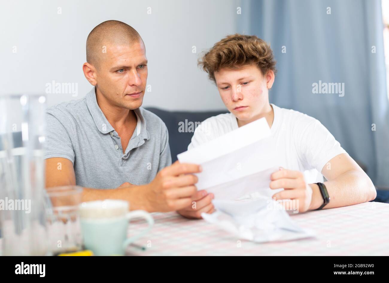 Father and son have recieved letter Stock Photo - Alamy