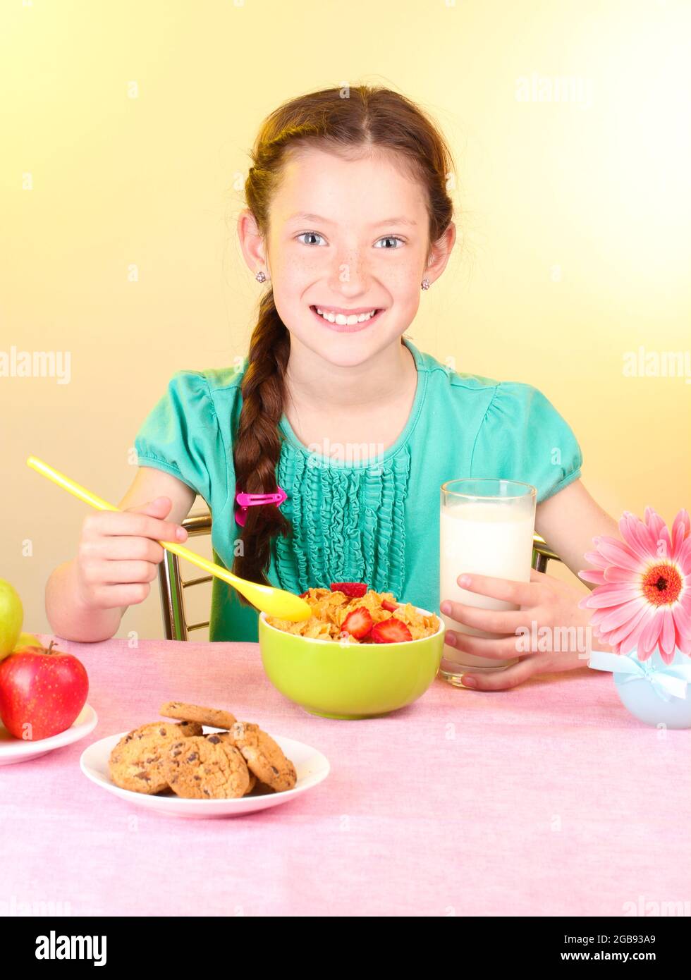 little beautiful girl have a breakfast on beige background Stock Photo ...