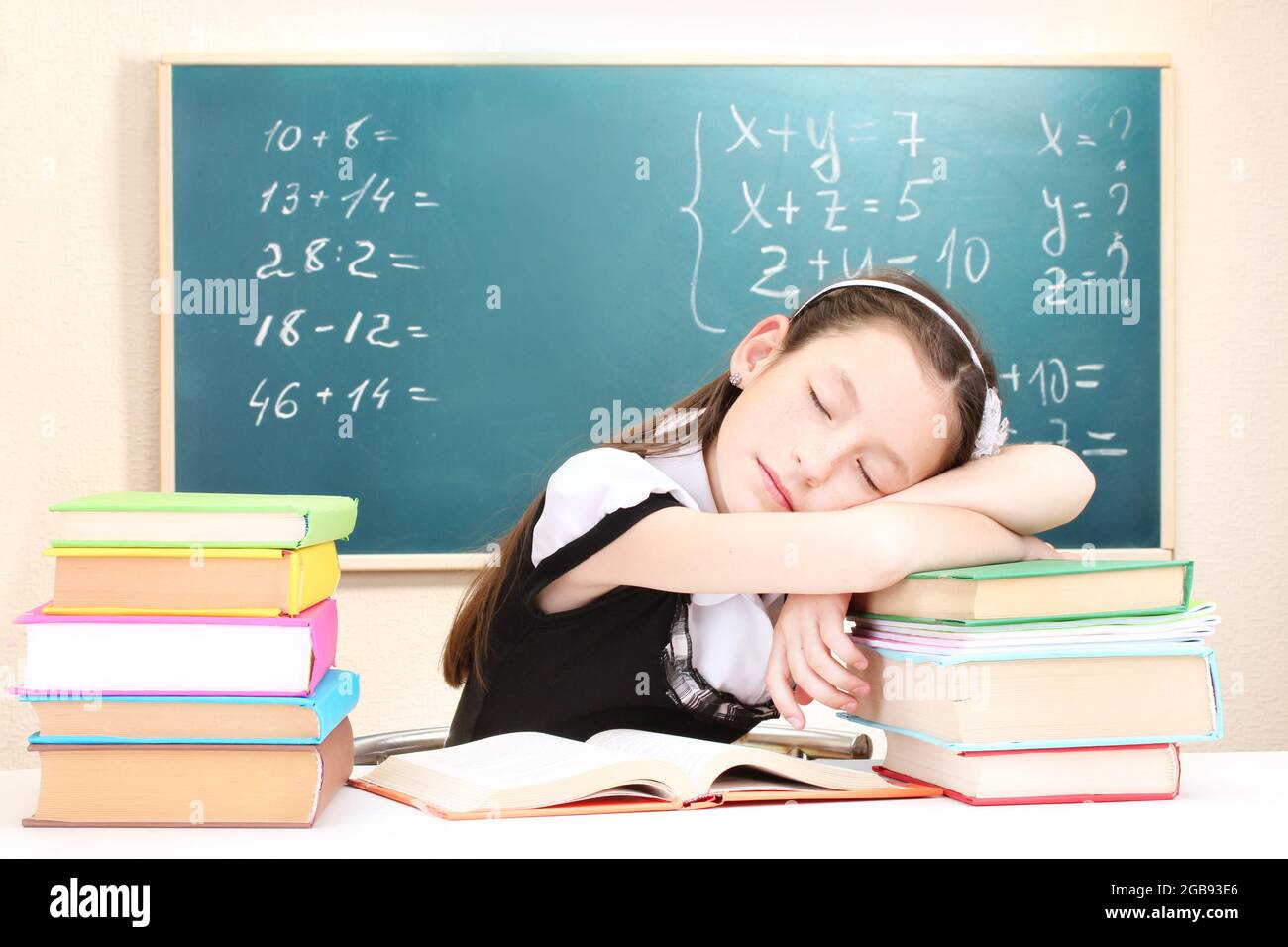 little schoolgirl sleep in classroom near blackboard Stock Photo - Alamy