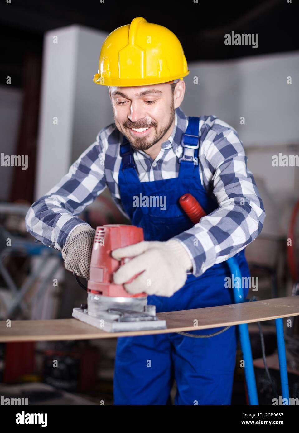 Male worker using grinder machine hi-res stock photography and images ...