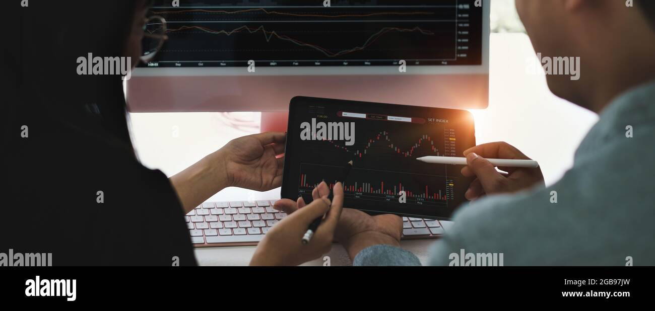 Business team working together analyze technical price graph and ...