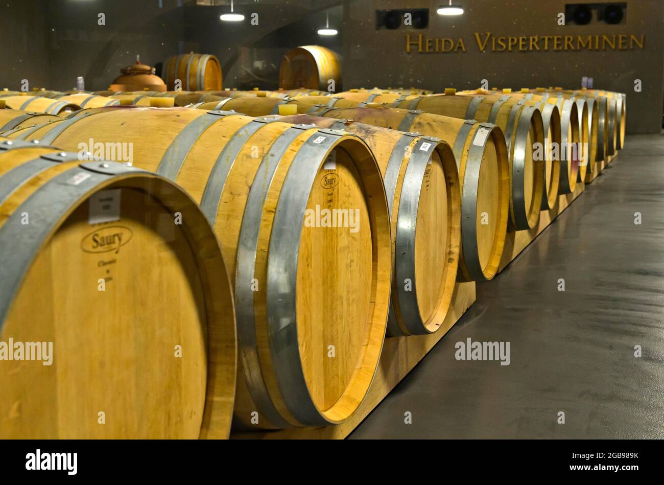 Saury oak barrels with Heida wine in the barrique cellar of the St ...