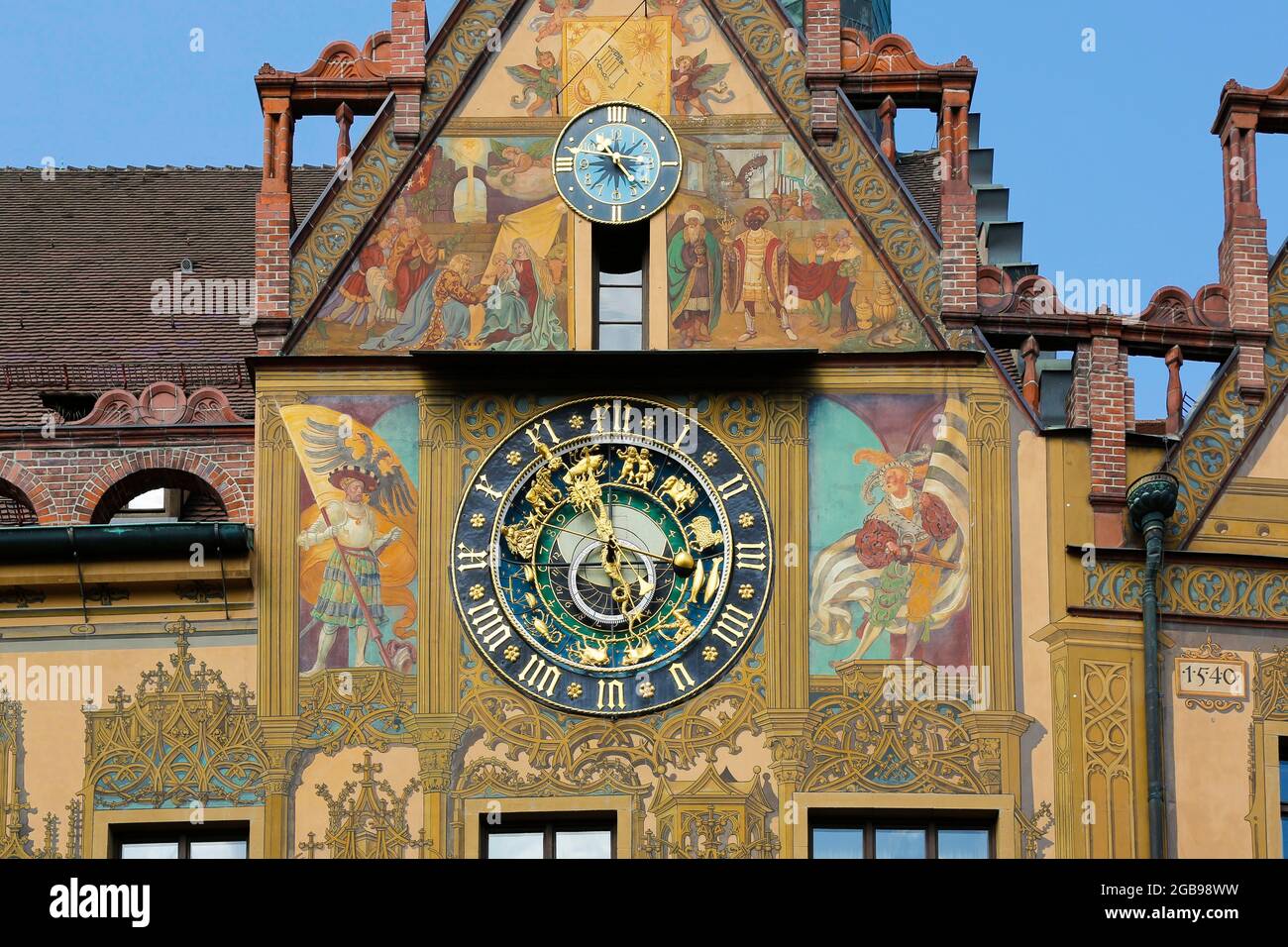 Richly decorated astronomical clock with signs of the zodiac on the ...