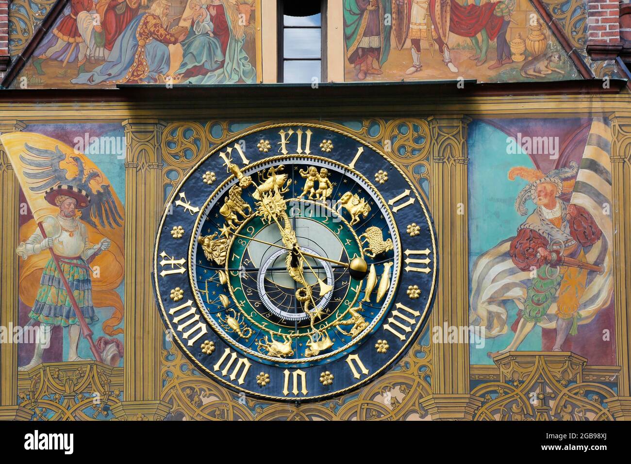 Richly decorated astronomical clock with signs of the zodiac on the ...