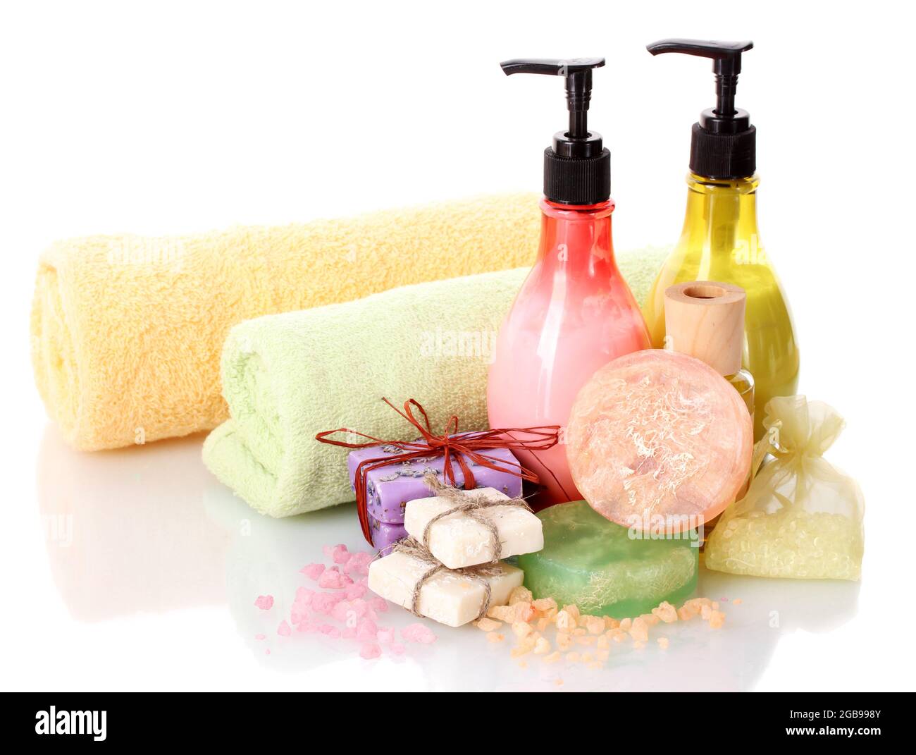 Bottles, soaps, sea salt and towels isolated on white Stock Photo - Alamy