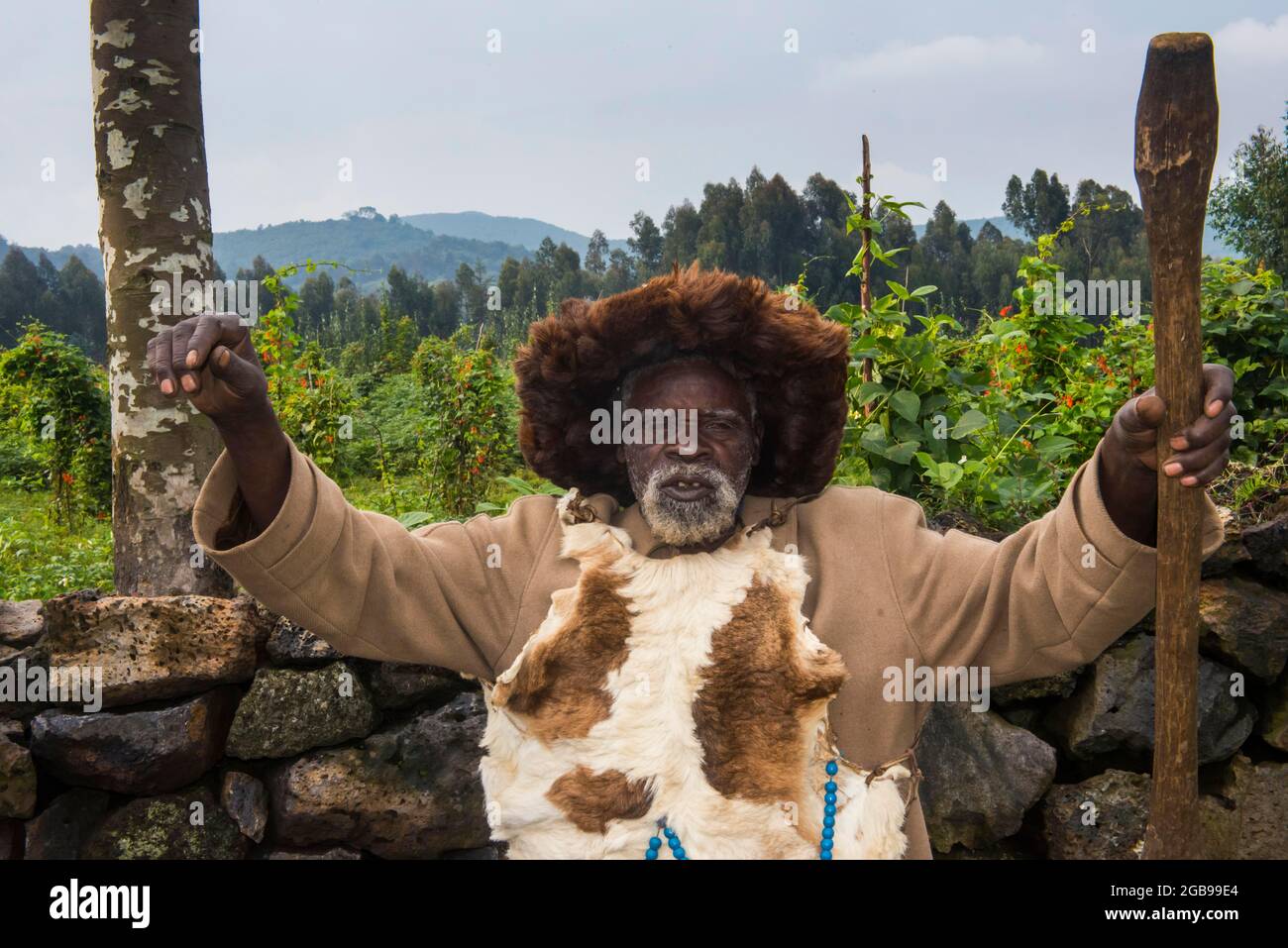 Old man preparing local herbs on a Ceremony of former poachers, in the ...