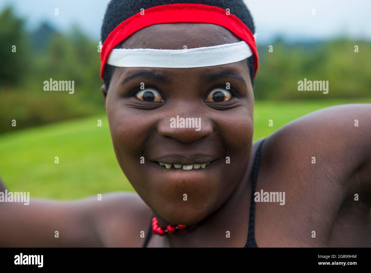 Woman starring at the camera at a ceremony of former poachers, in the ...