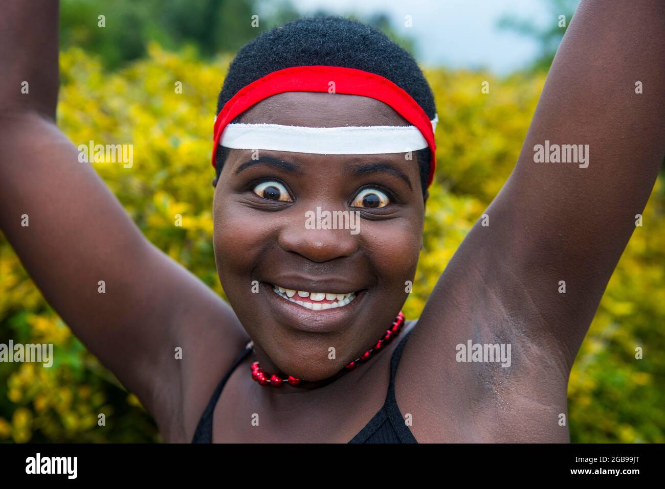 Woman starring at the camera at a ceremony of former poachers, in the ...