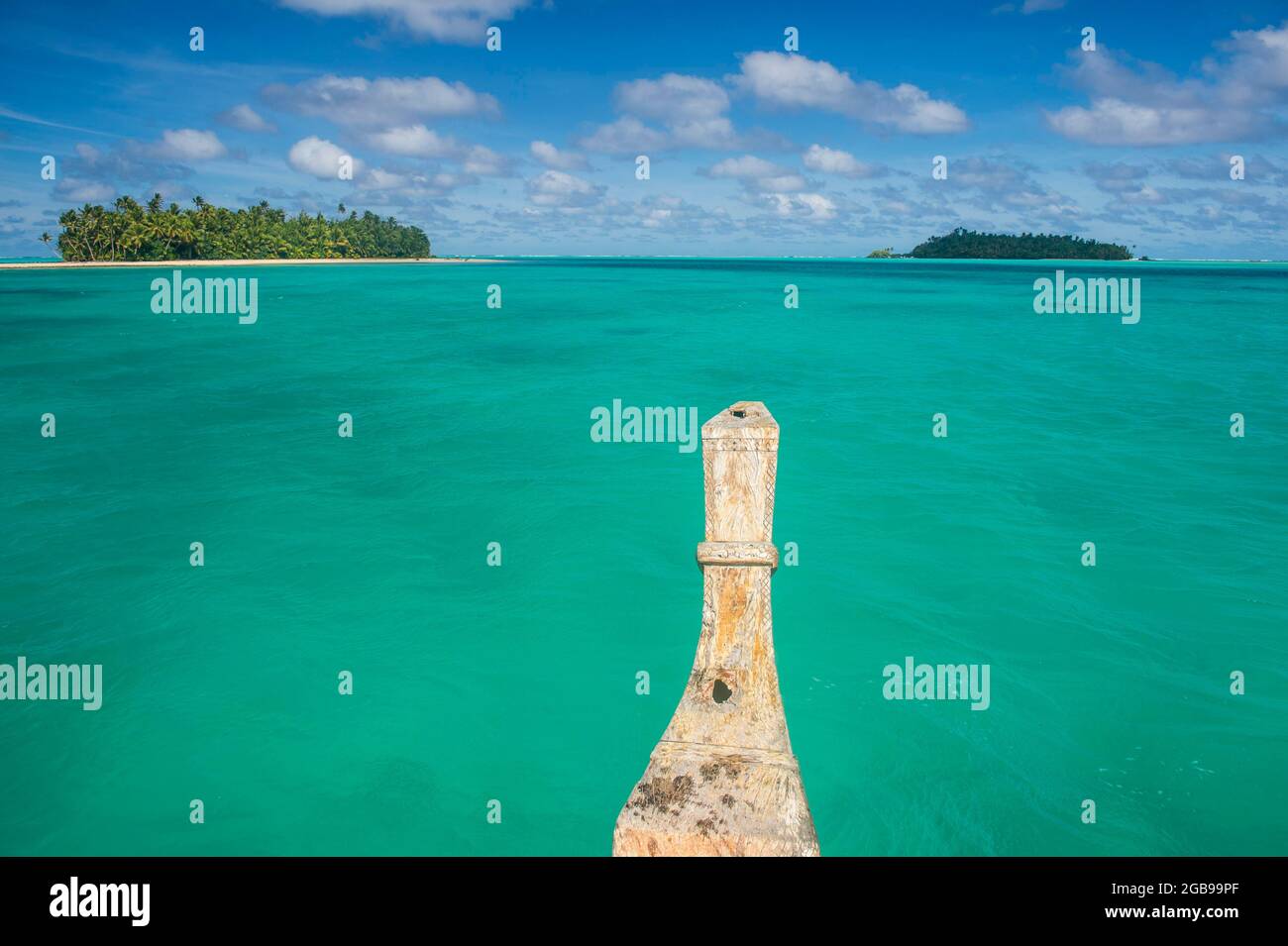 Traditional wood carved boat in the Aitutaki lagoon, Rarotonga and the ...