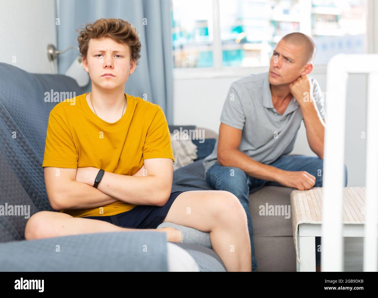 Father comforting his son Stock Photo - Alamy