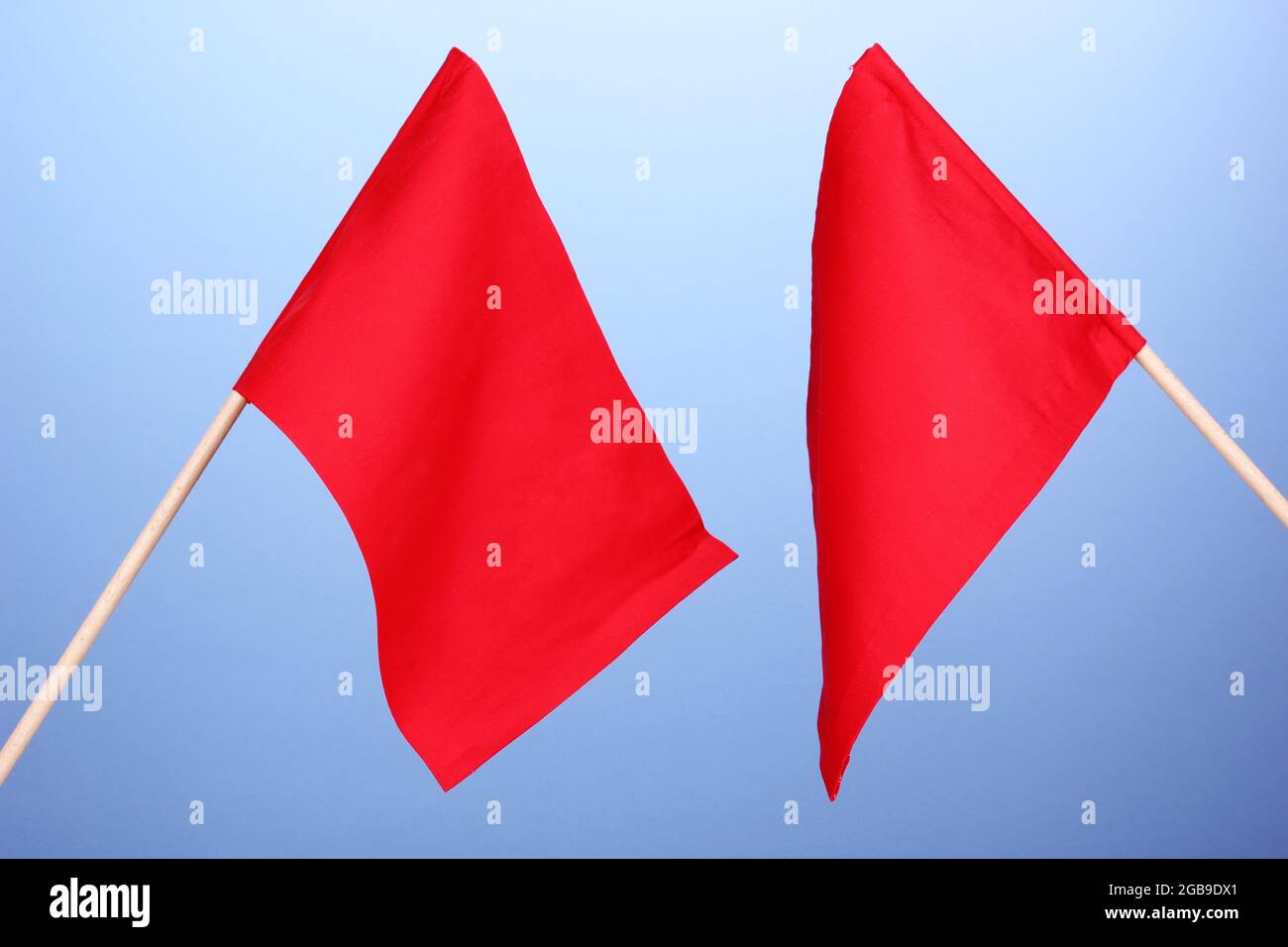 Red signal flags on blue background Stock Photo - Alamy