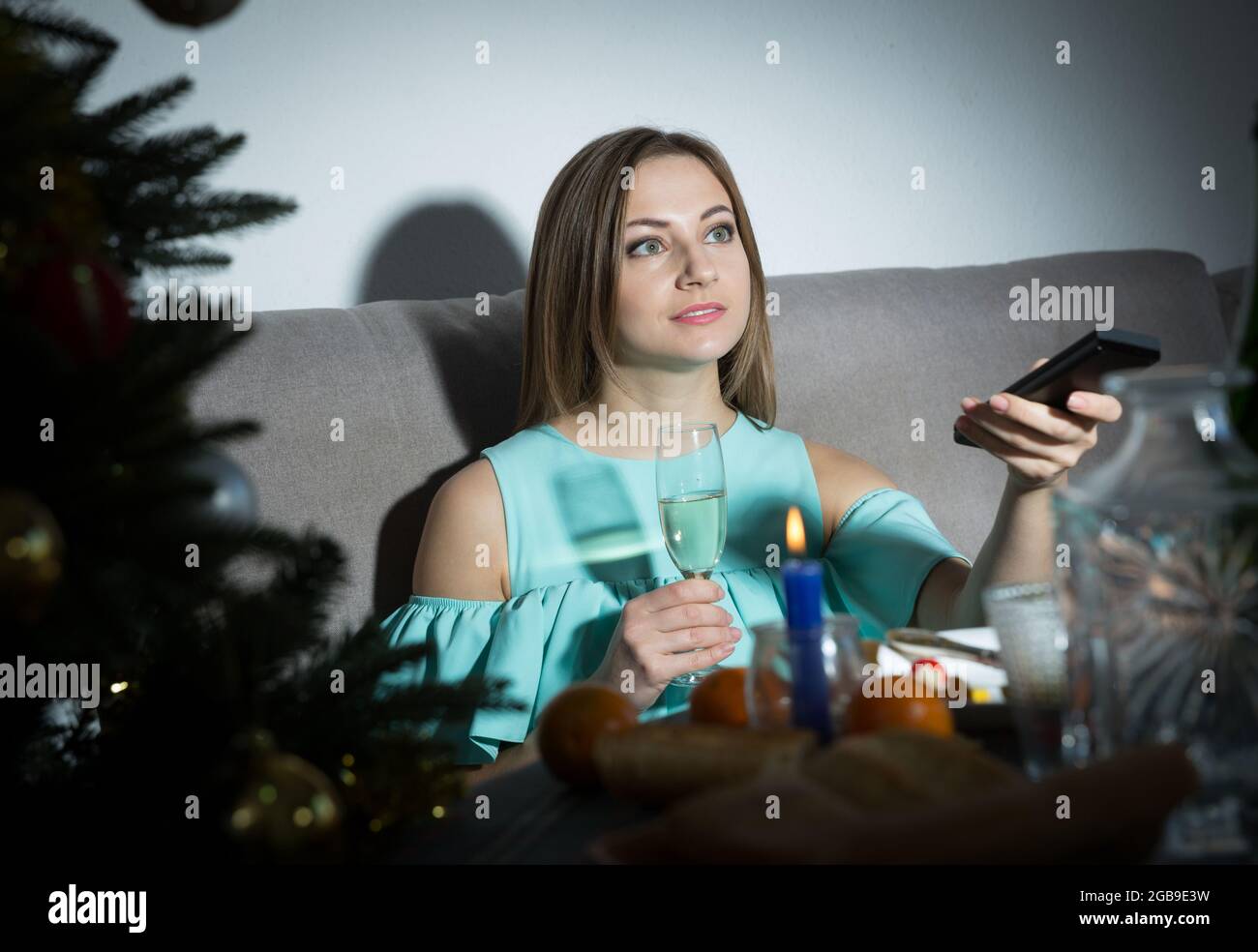 Woman watching tv alone hi-res stock photography and images - Alamy