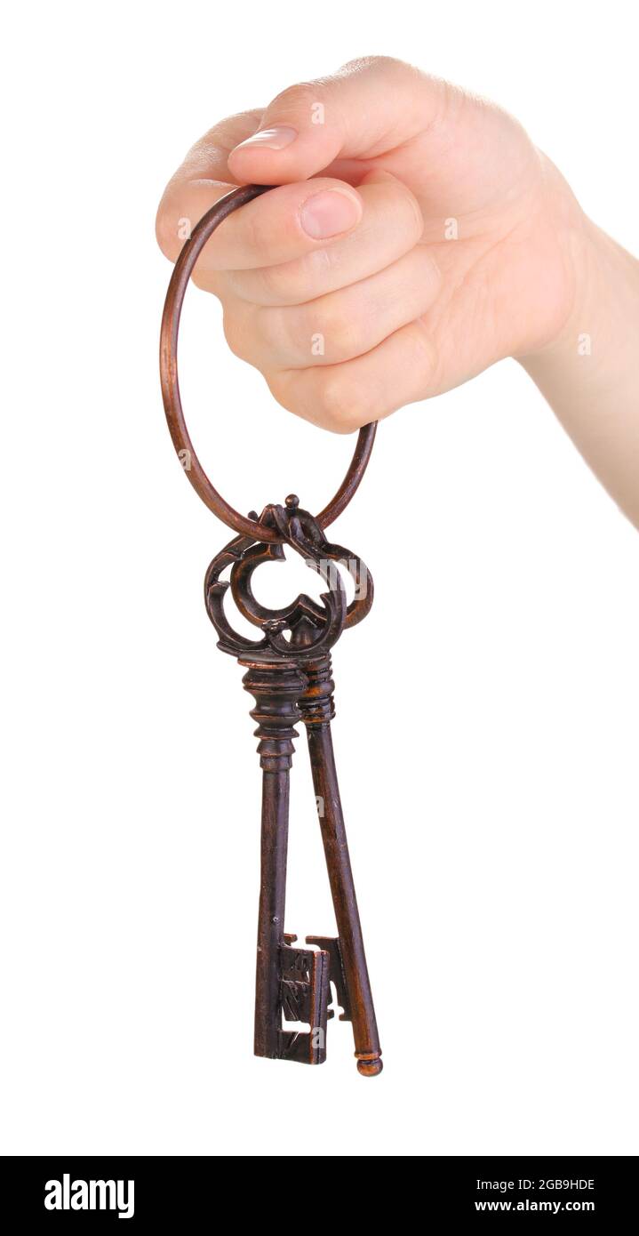 woman's hand holding a bunch of antique keys on white background Stock ...