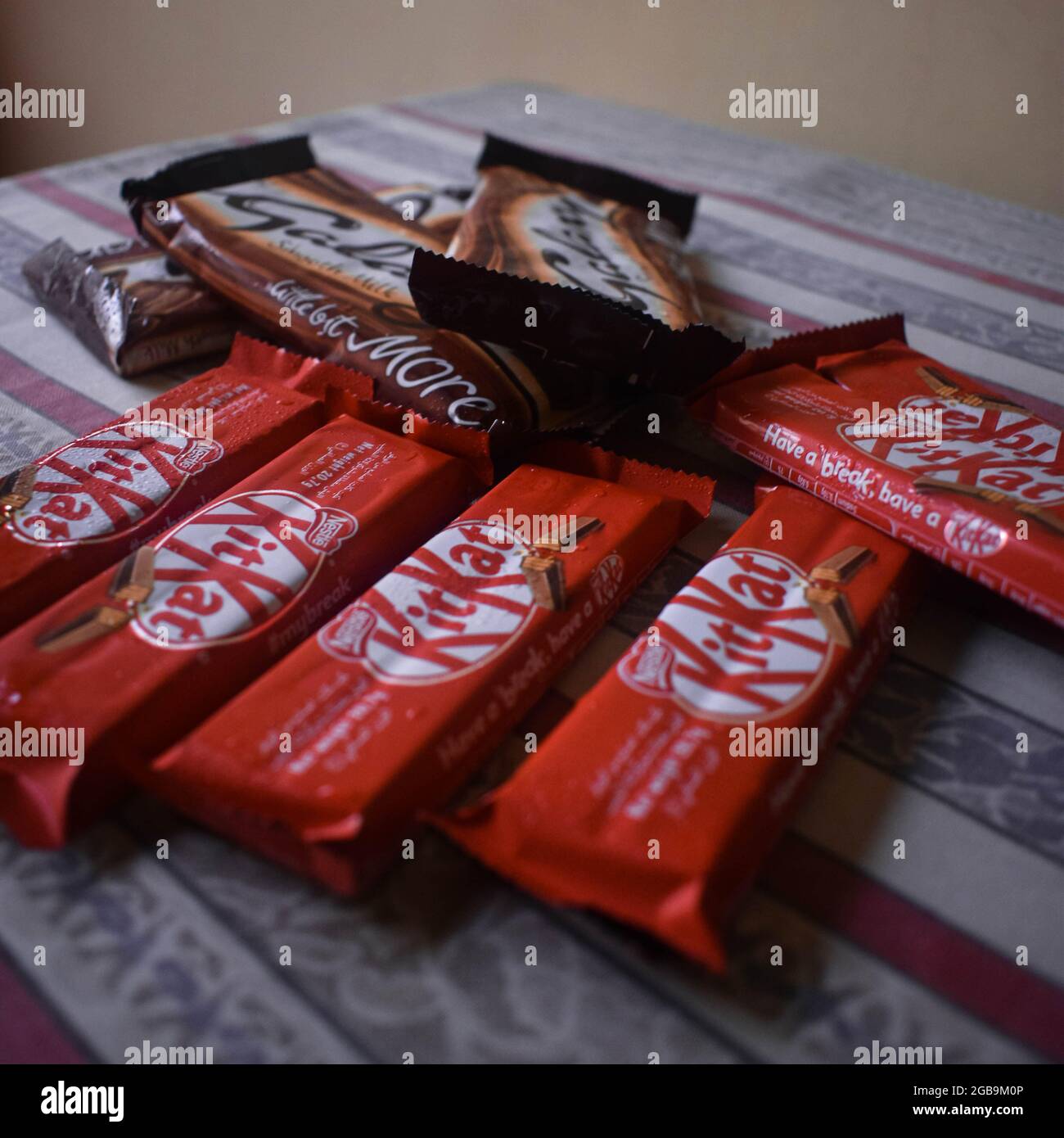 Kit Kat and Galaxy Chocolate lying on table for display Stock Photo - Alamy