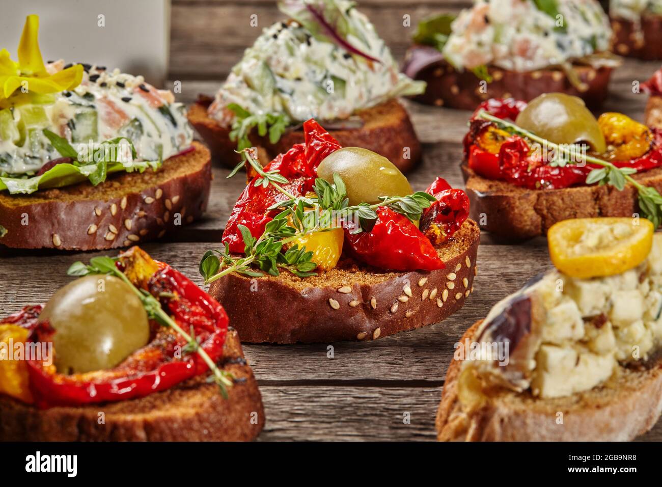 Canapes on toasted baguette slices with various toppings Stock Photo ...