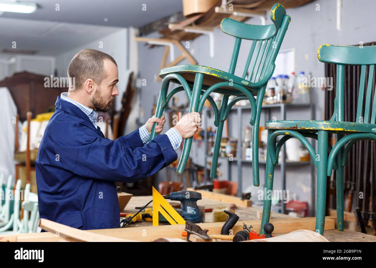 Carpenter repairing antique chair Stock Photo - Alamy