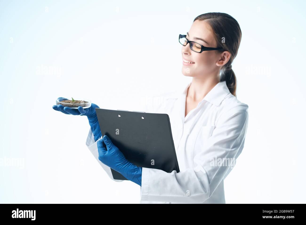female laboratory assistant in white coat chemical solution research ...