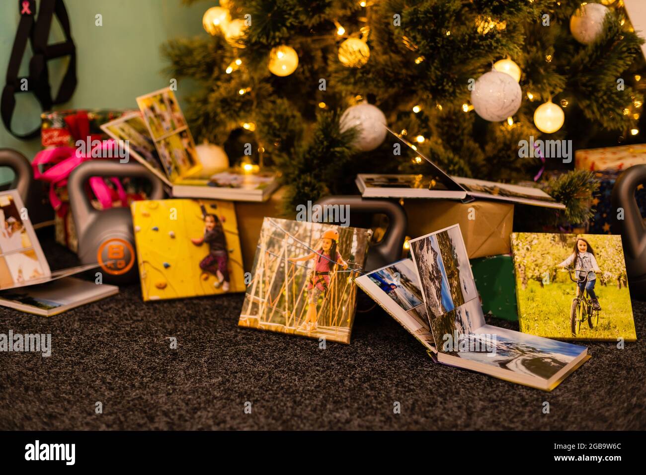 photobook, album and weights for sports near the Christmas tree as a ...