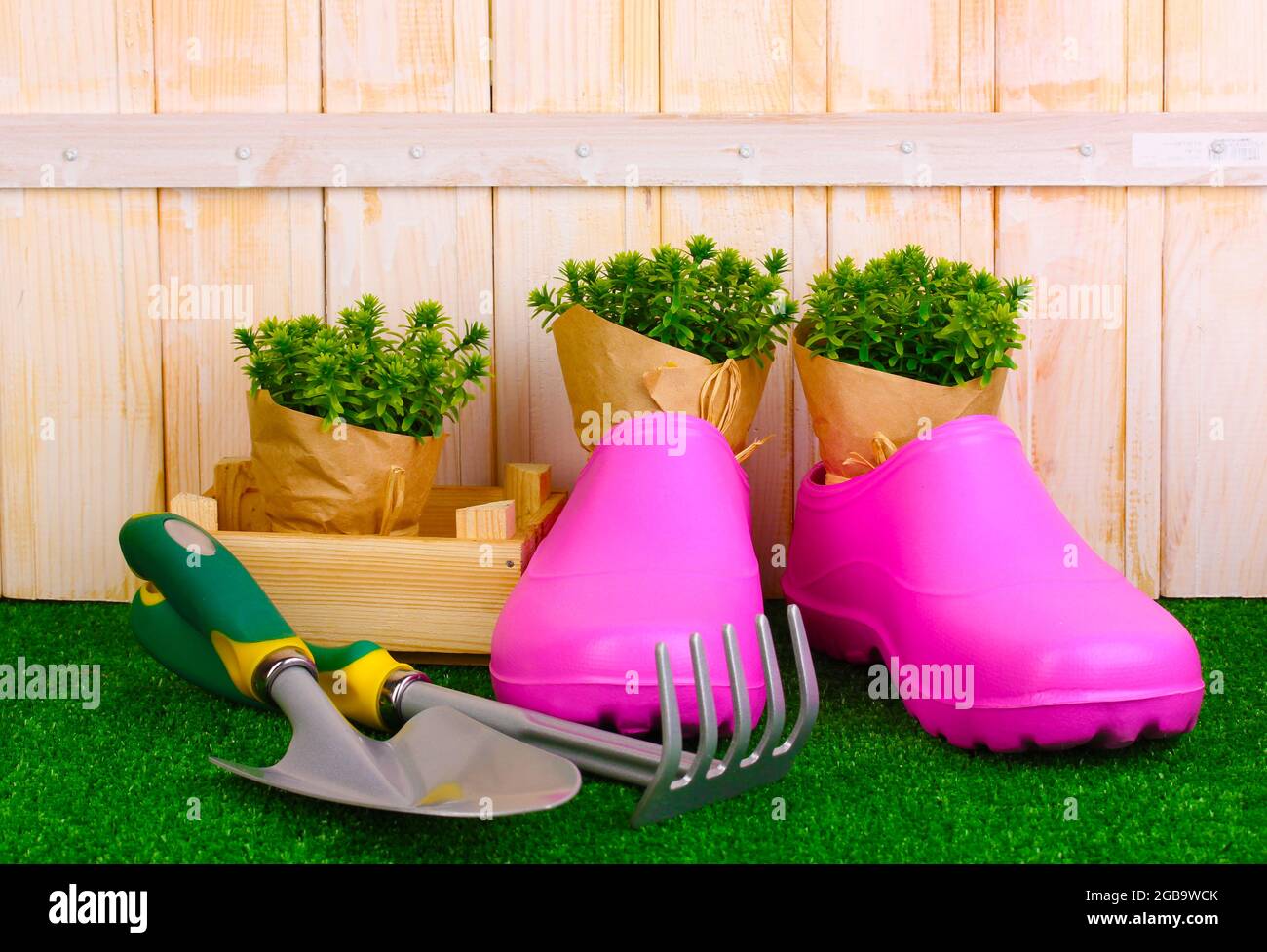 Gardening tools on wooden background Stock Photo - Alamy