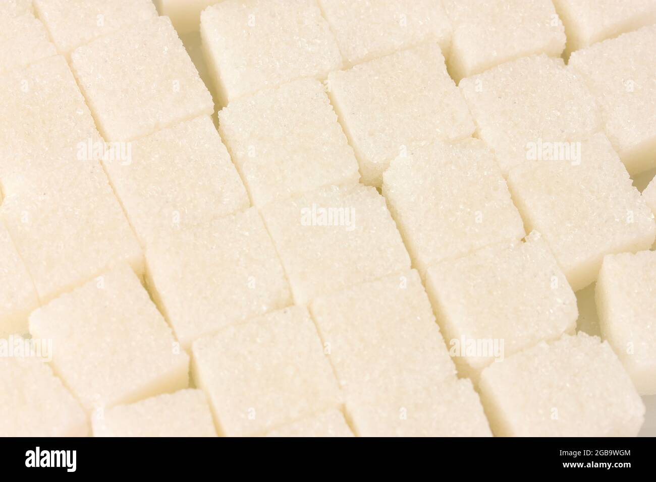White lump sugar background close-up Stock Photo - Alamy