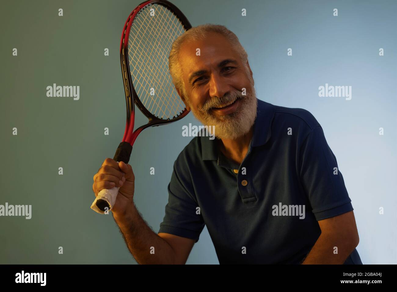 Old man holding racket hi-res stock photography and images - Alamy