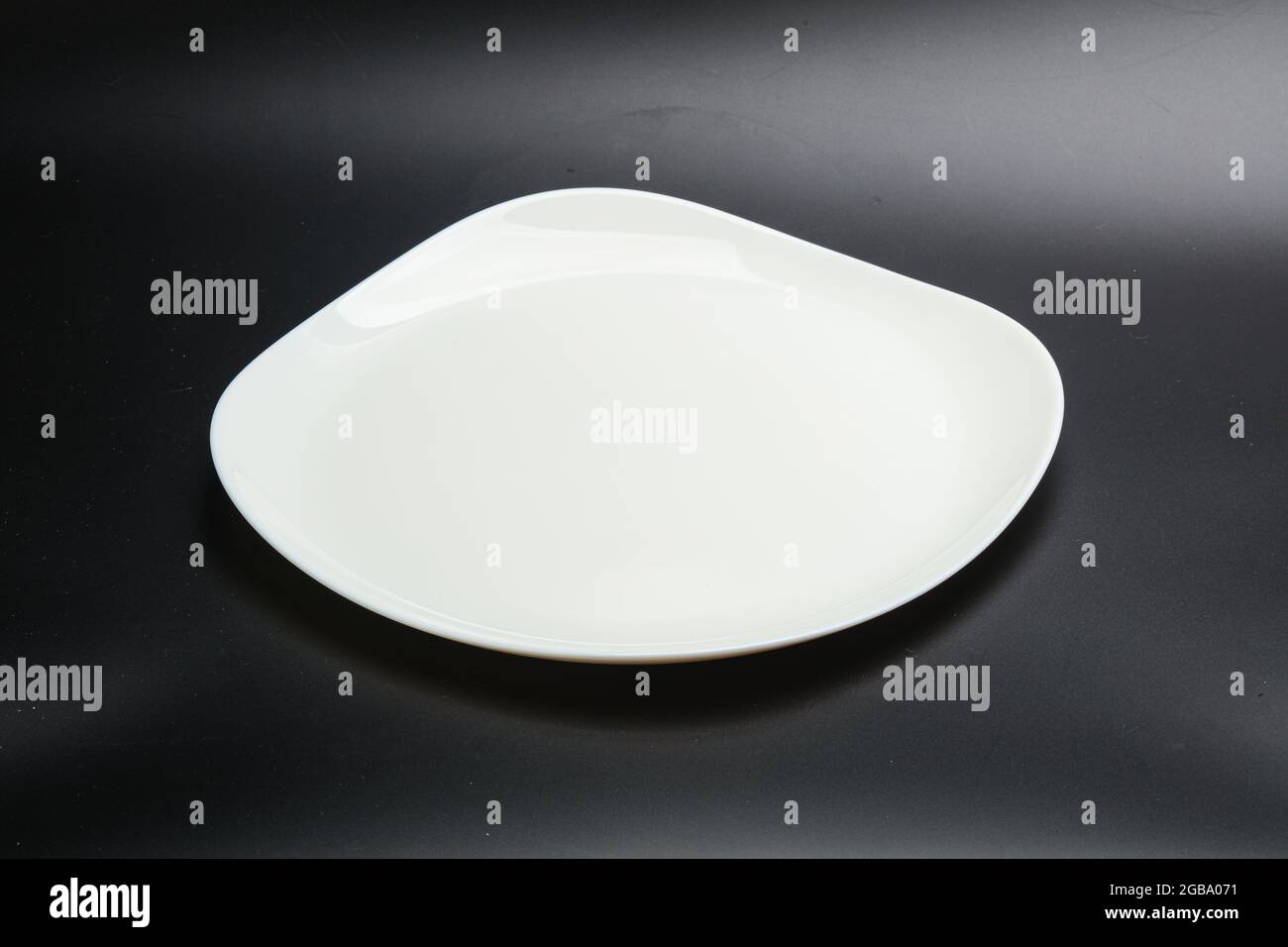 White empty plate for serving isolated Stock Photo - Alamy