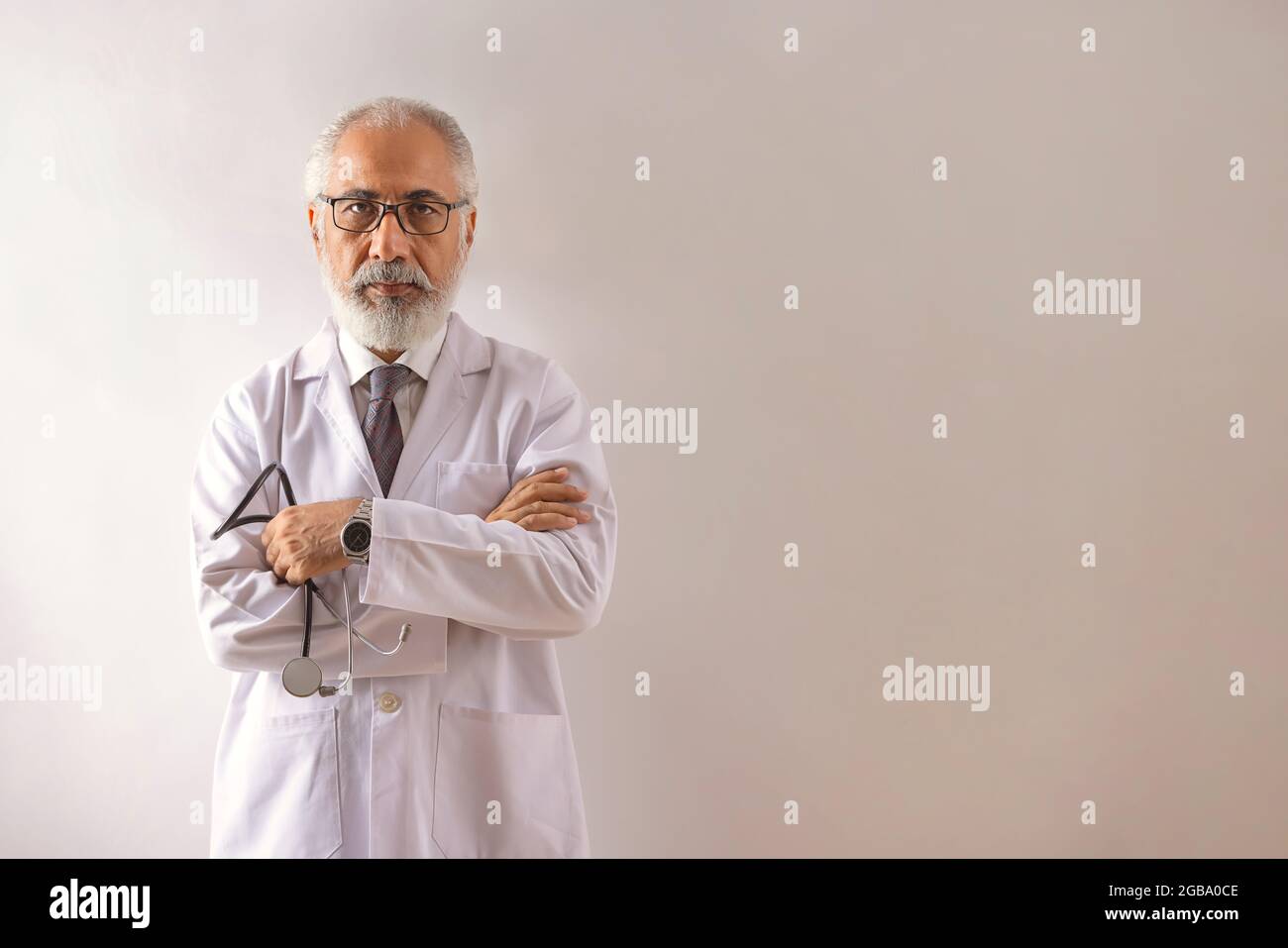 Old man doctor posing hi-res stock photography and images - Alamy