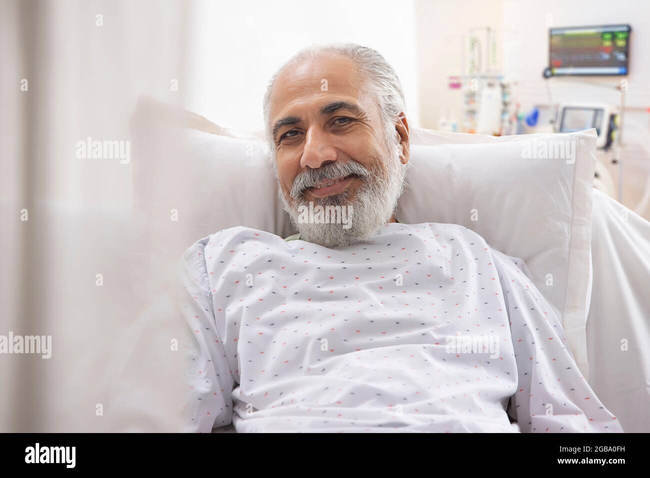 A CHEERFUL OLD MAN LOOKING AT CAMERA WHILE RESTING Stock Photo - Alamy