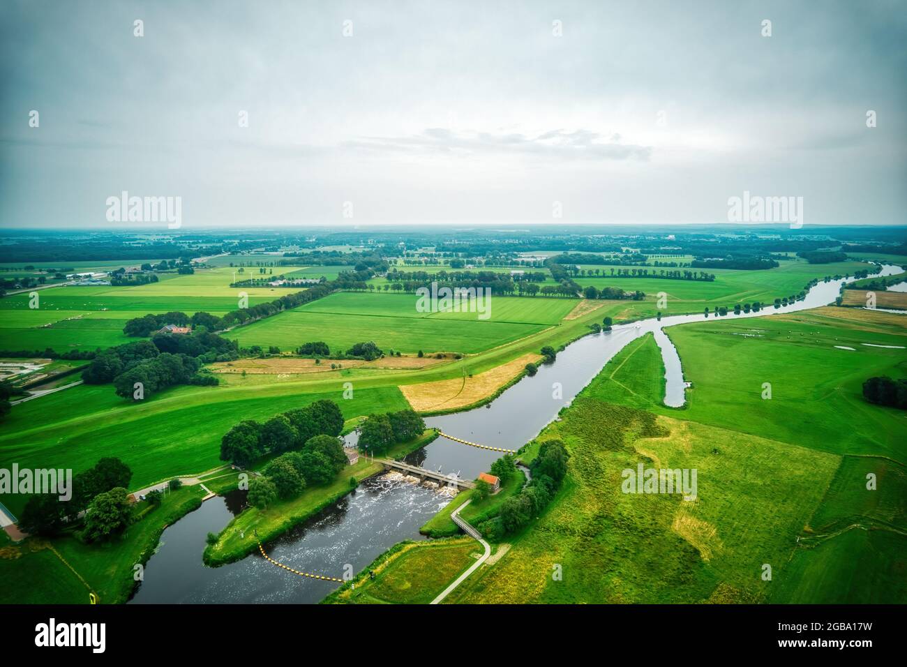 Airial view of a weir in the river Vecht. Dutch river in a colorful ...