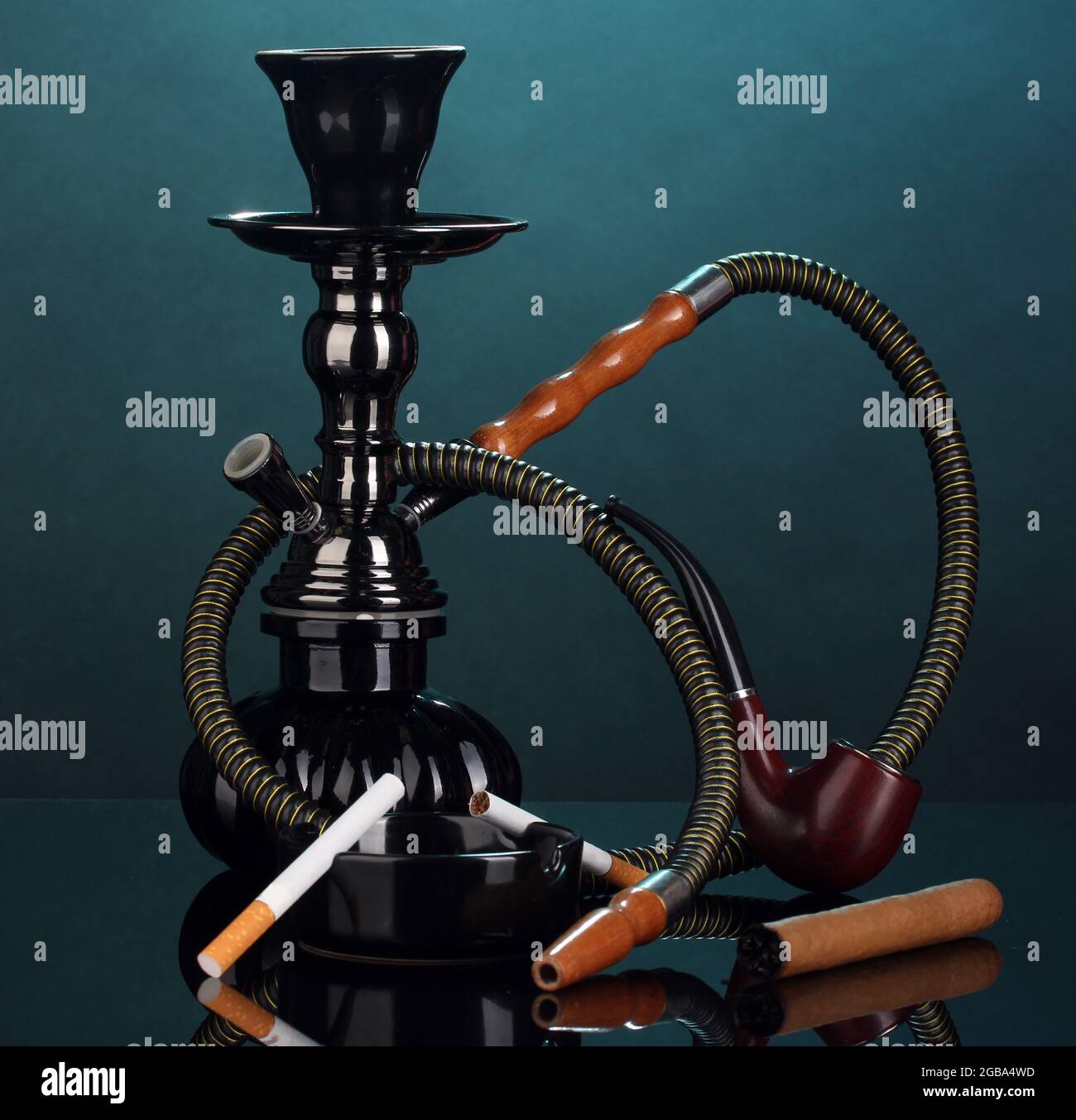 Smoking tools - a hookah, cigar, cigarette and pipe on blue background ...