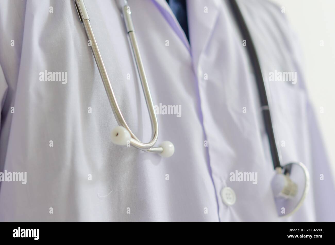 Closeup where the patient's stethoscope is at the doctor's neck Stock ...