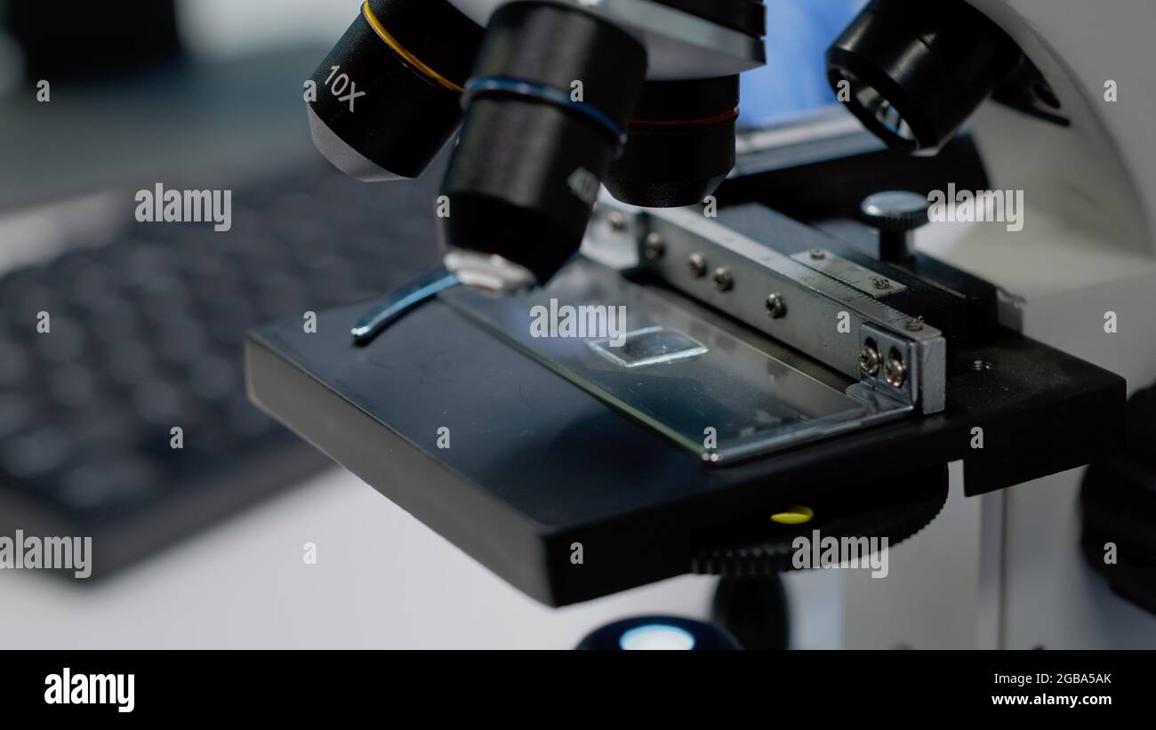 Close up of microscopic sample tray for optical analysis in laboratory ...